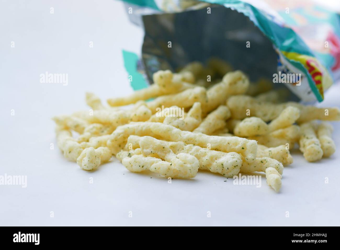 tasty potato chips in a packet on white Stock Photo - Alamy