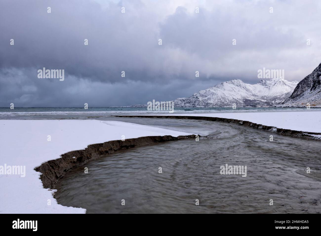 On the snow covered beach of the grotfjord in northern norway hi-res ...