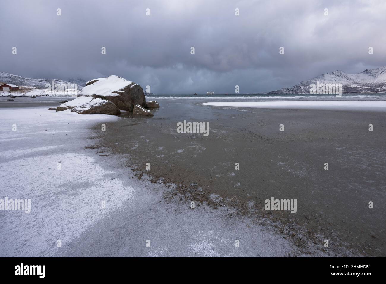 On the snow covered beach of the grotfjord in northern norway hi-res ...