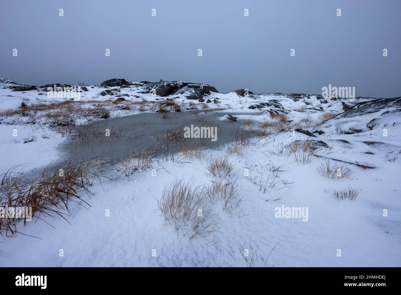 Snow and ice on Hillesoy Mountain near Sommaroy Island in Troms Norway ...