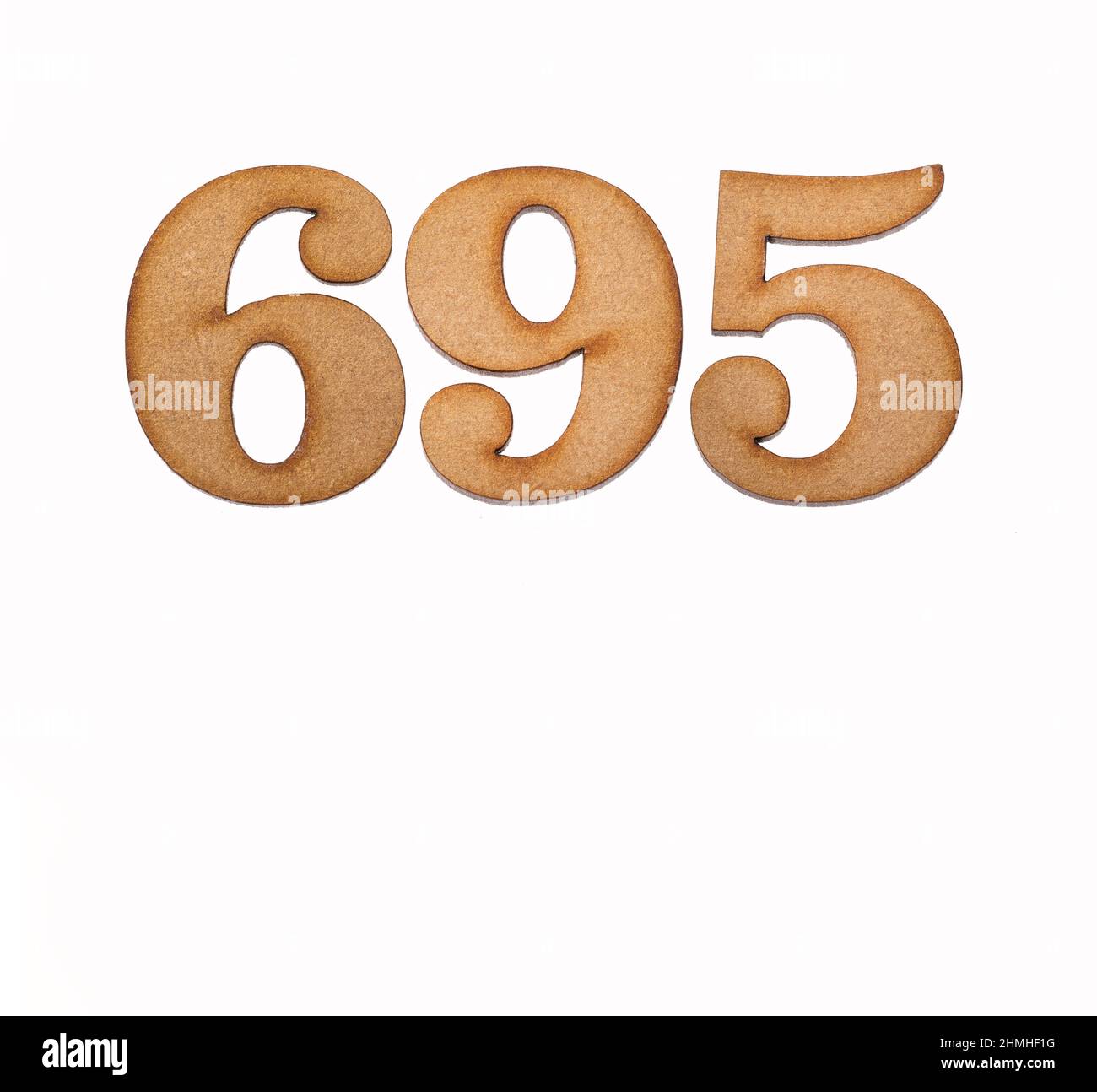 Number 695 in wood, isolated on white background Stock Photo - Alamy