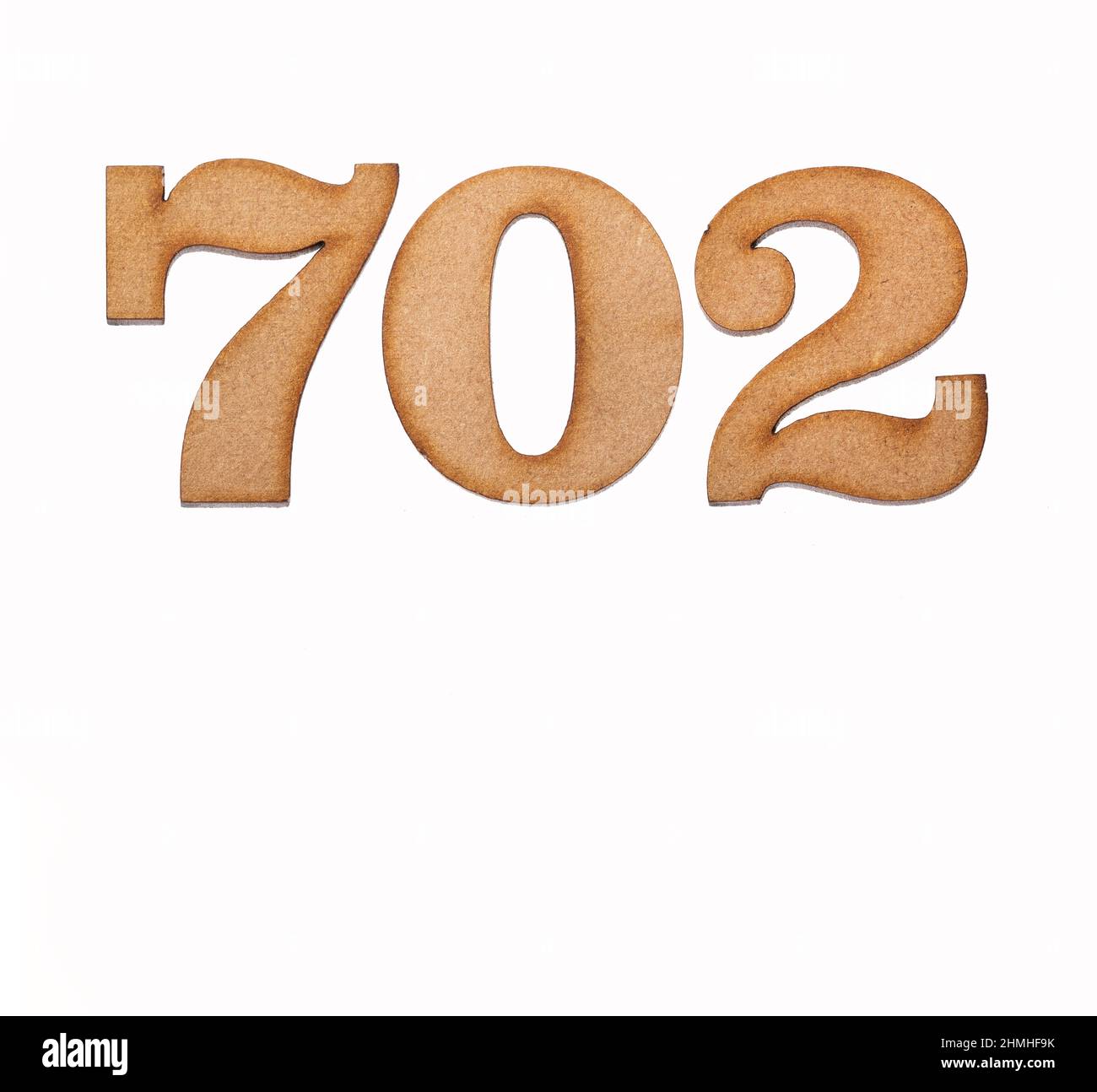 Number 702 - Piece of wood isolated on white background Stock Photo - Alamy