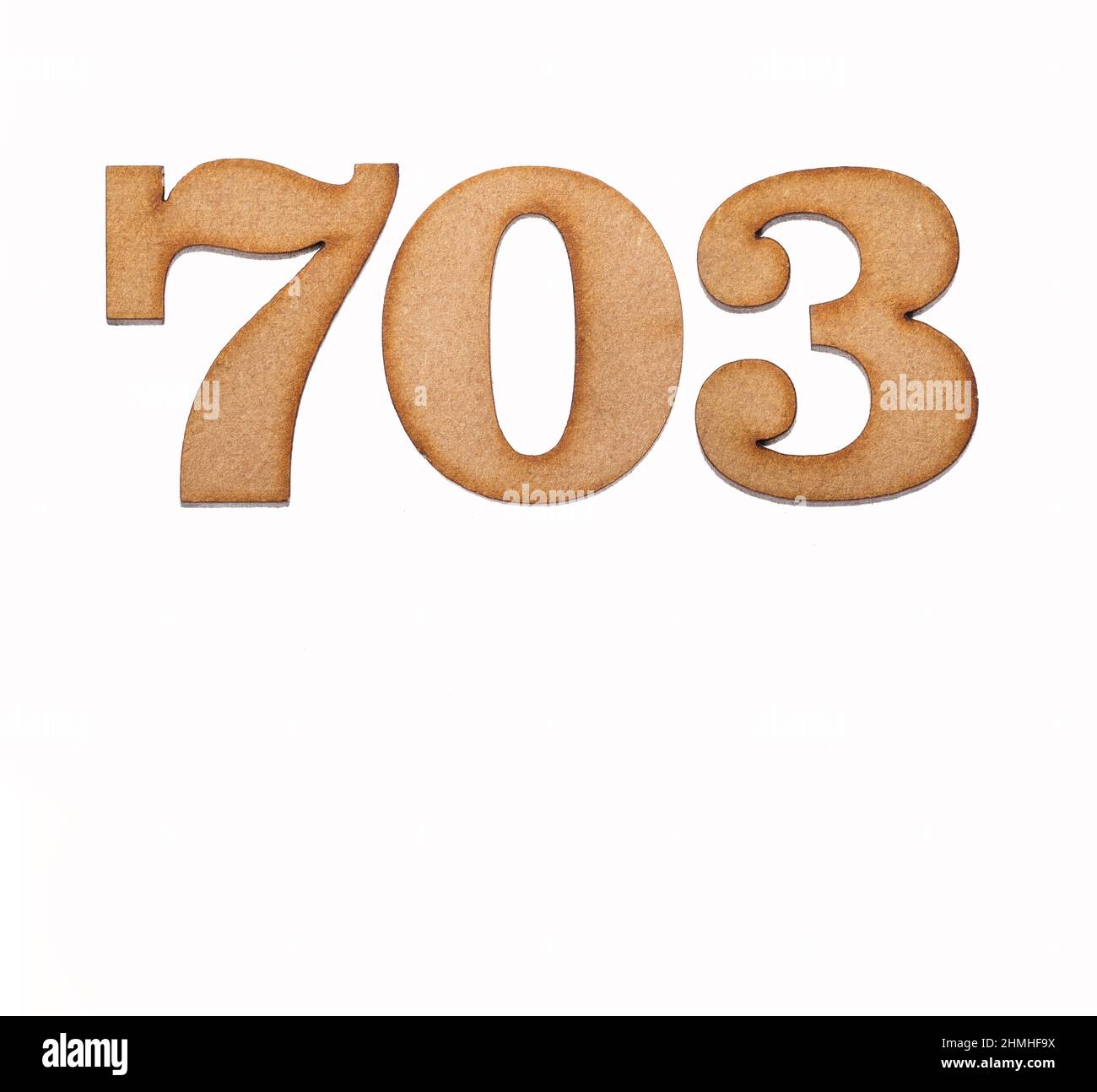 Number 703 in wood, isolated on white background Stock Photo - Alamy