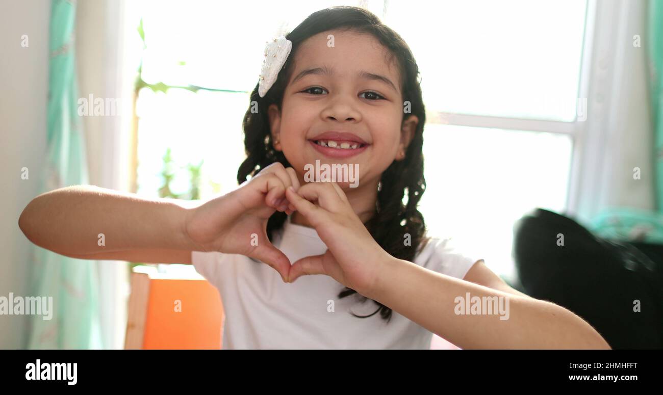Child making heart symbol with hands Stock Photo - Alamy