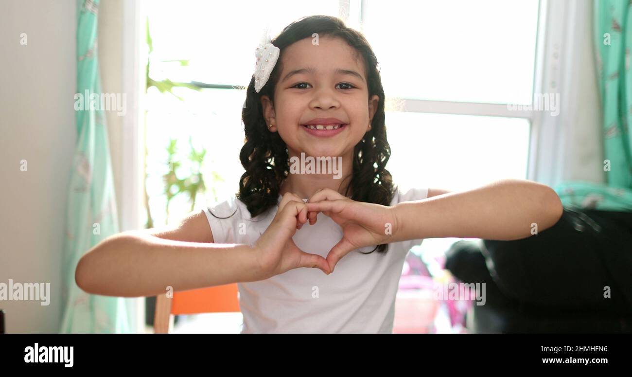 Child making heart symbol with hands Stock Photo - Alamy