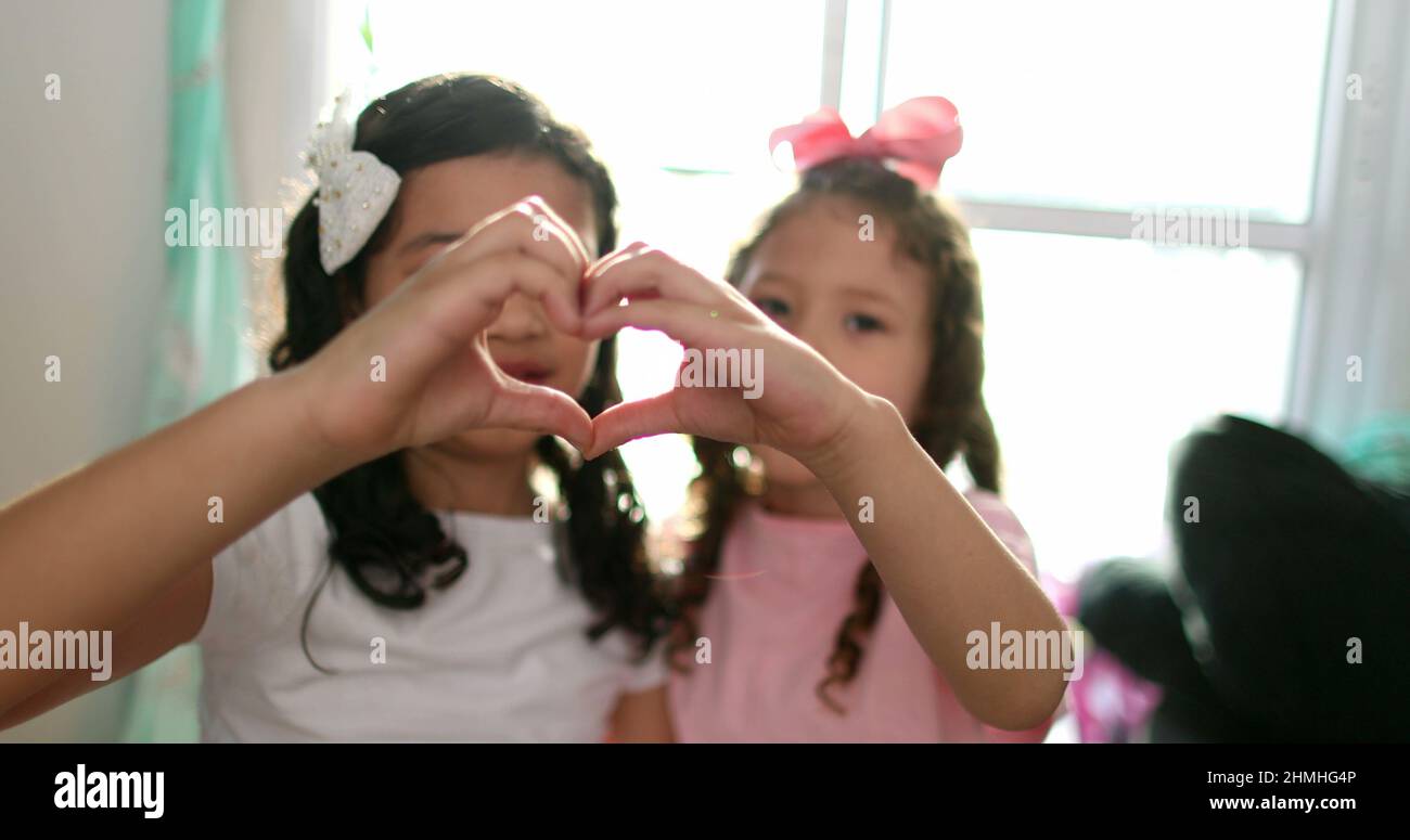 Children doing heart symbol with hands together close-up Stock Photo ...