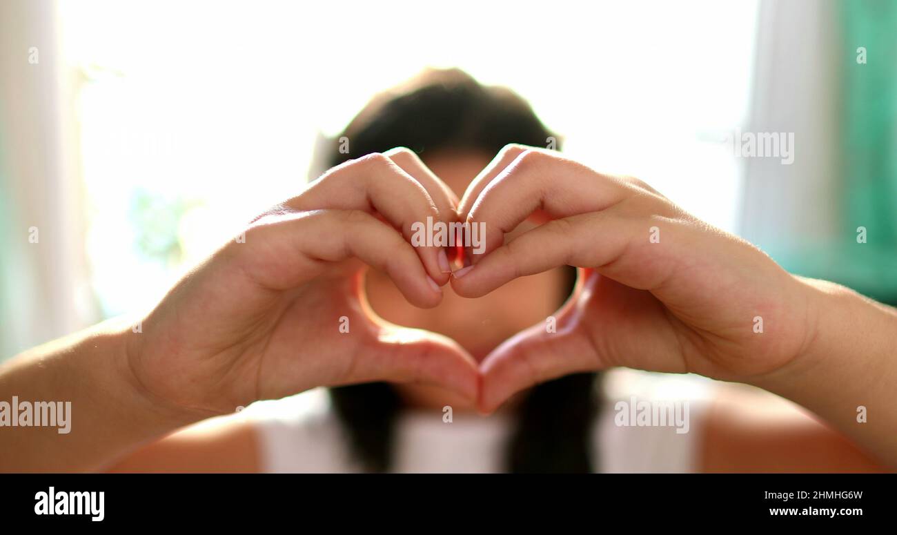 Girl doing hands heart hi-res stock photography and images - Alamy