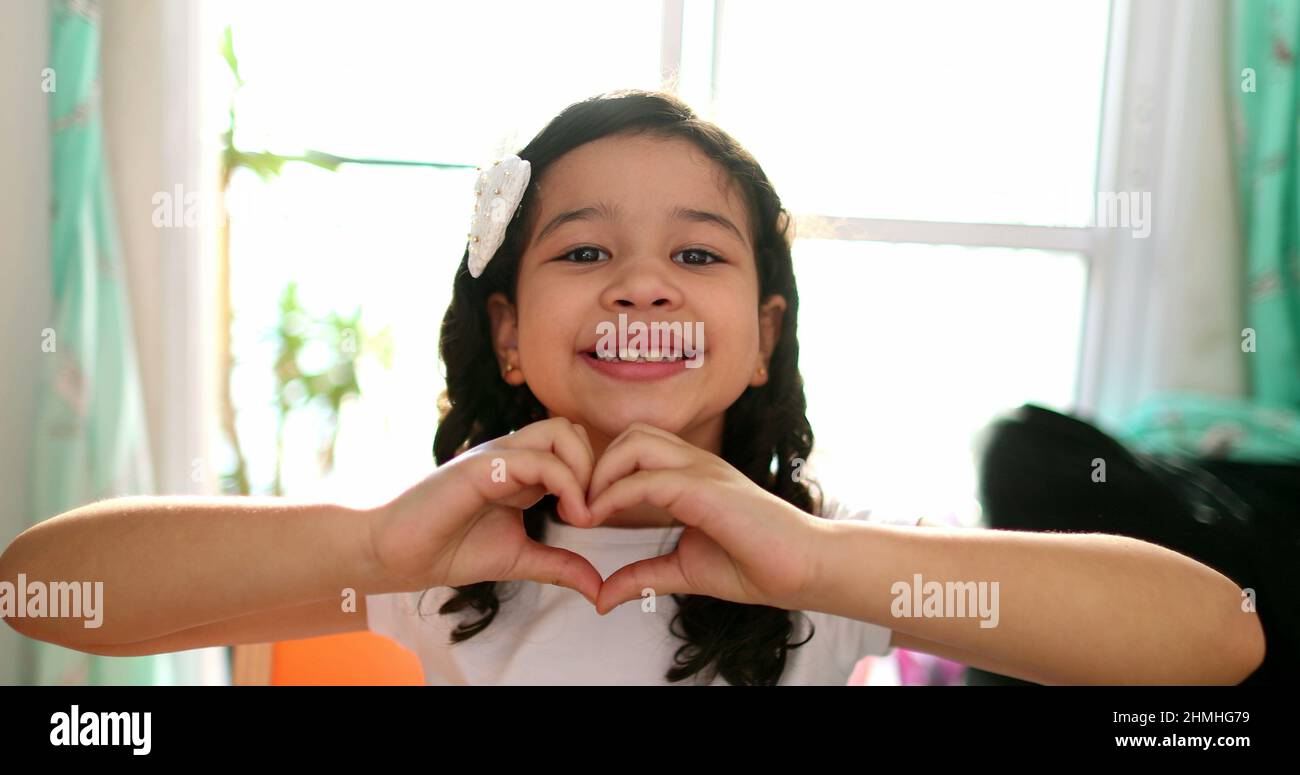 Girl doing hands heart hi-res stock photography and images - Alamy