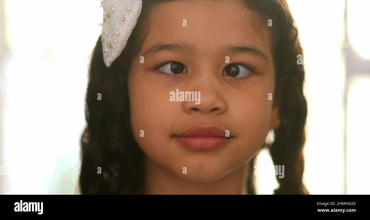 Funny little girl doing crossed eyes Stock Photo - Alamy