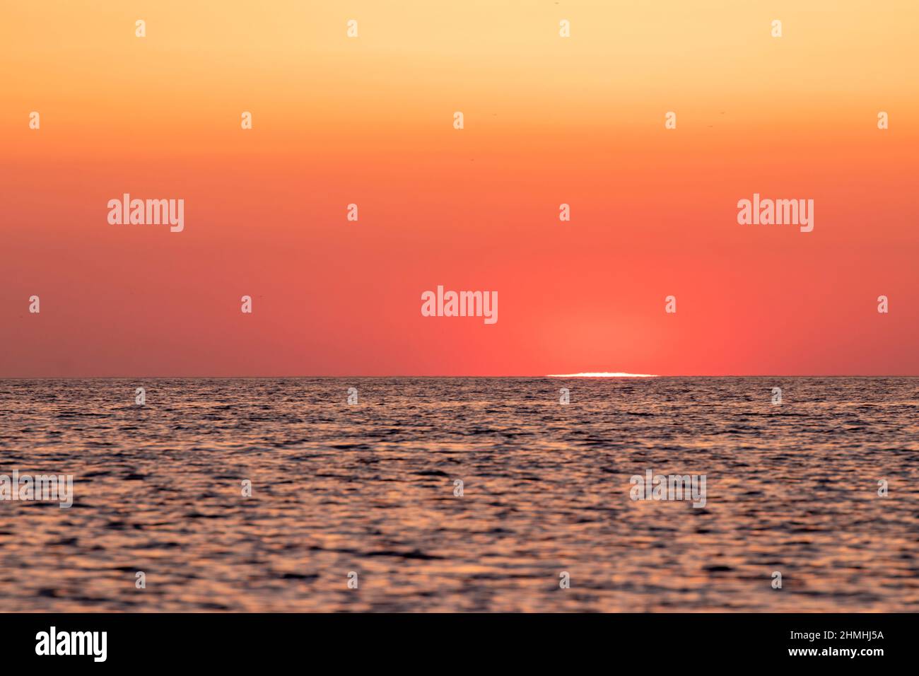 sun rising at dawn over the mediterranean sea on the costa brava Stock ...