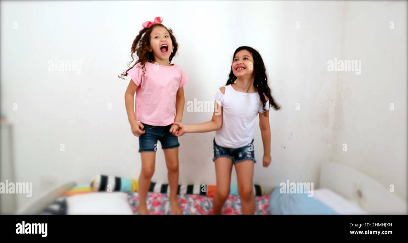 Girl bouncing on bed hi-res stock photography and images - Alamy