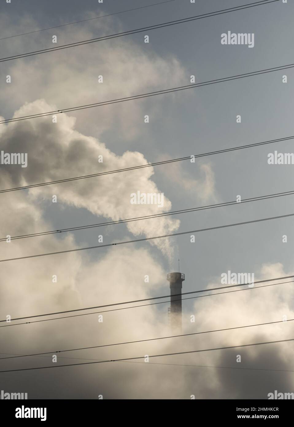 Fumes and pollution in factory chimneys Stock Photo - Alamy