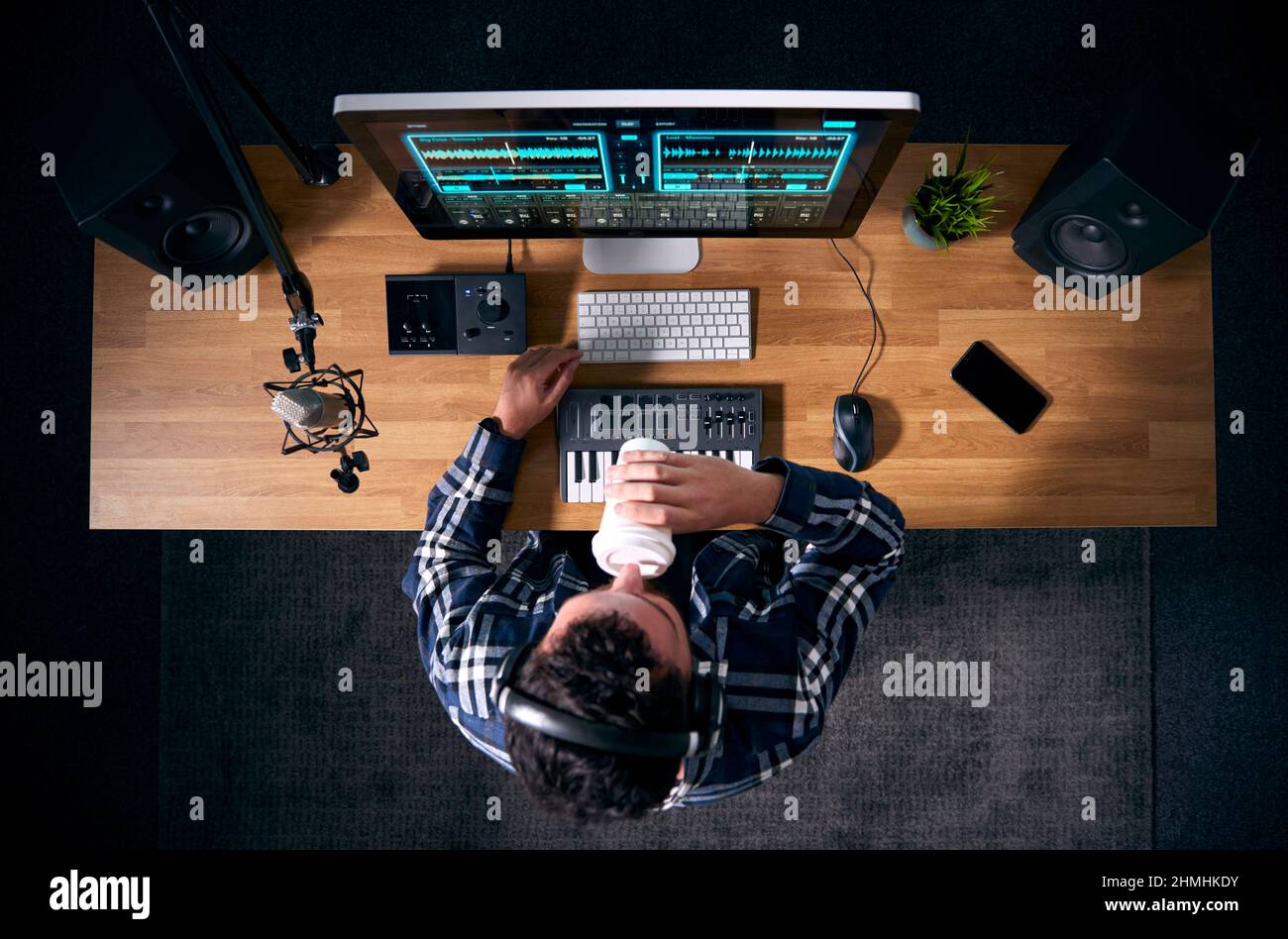 Overhead View Of Male Musician At Workstation With Keyboard And ...