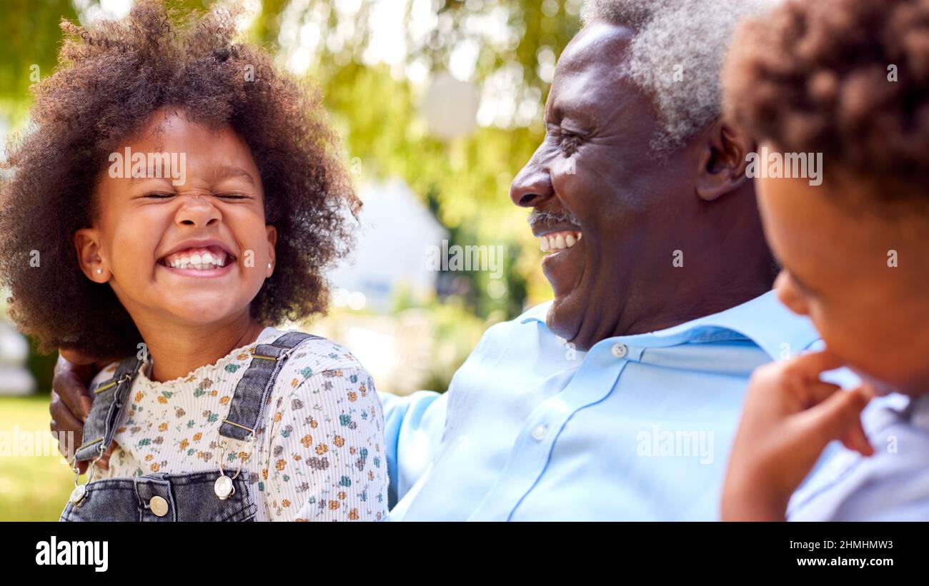 African american grandfather hugging grandson hi-res stock photography ...