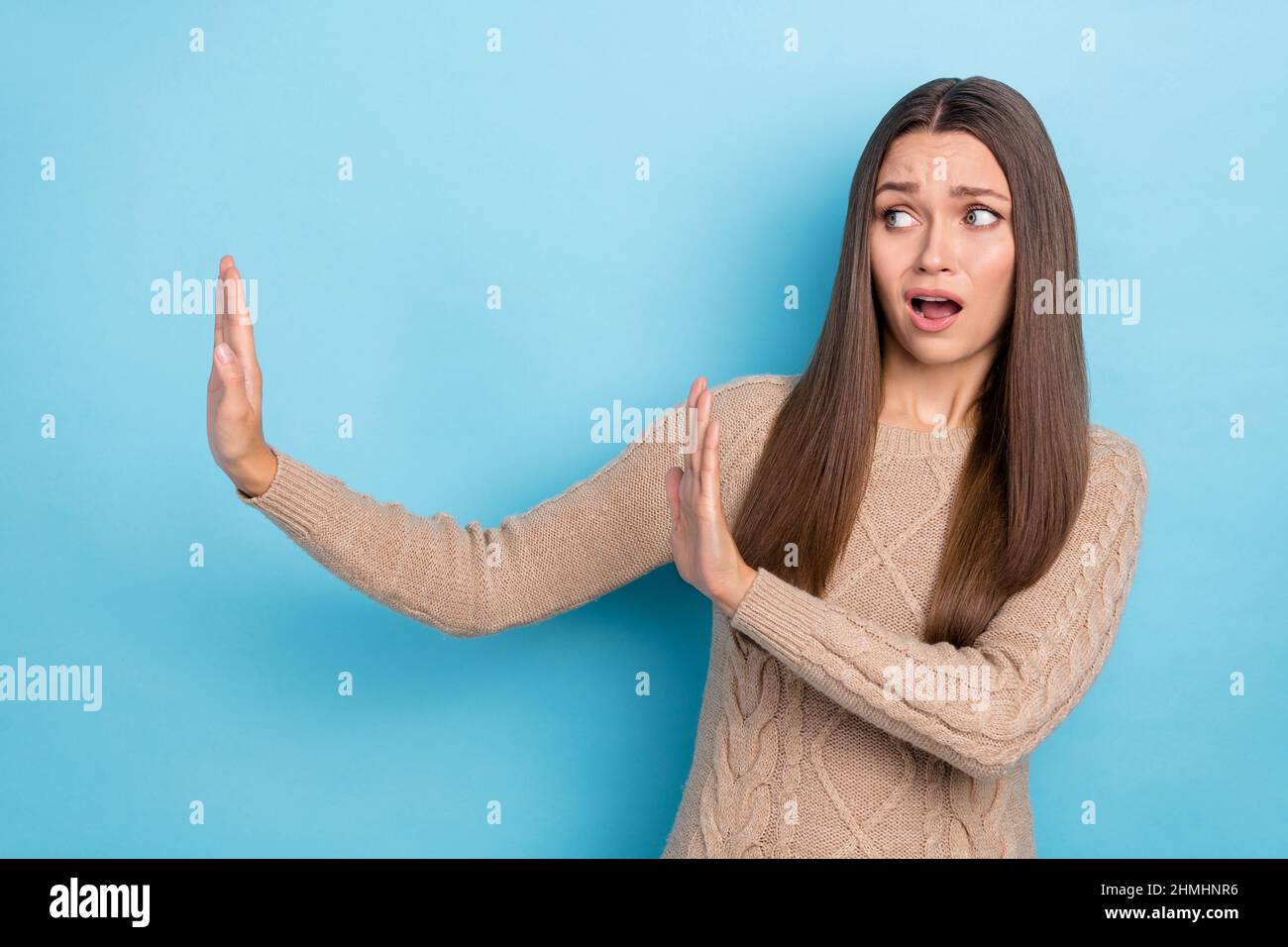 Portrait of attractive worried scared girl showing stop protect sign ...