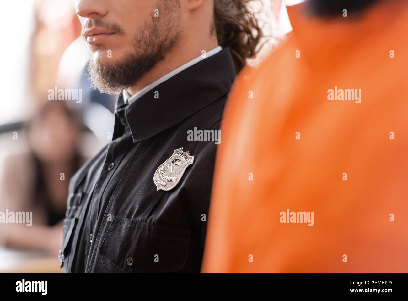 partial view of bearded bailiff in black uniform in court Stock Photo ...