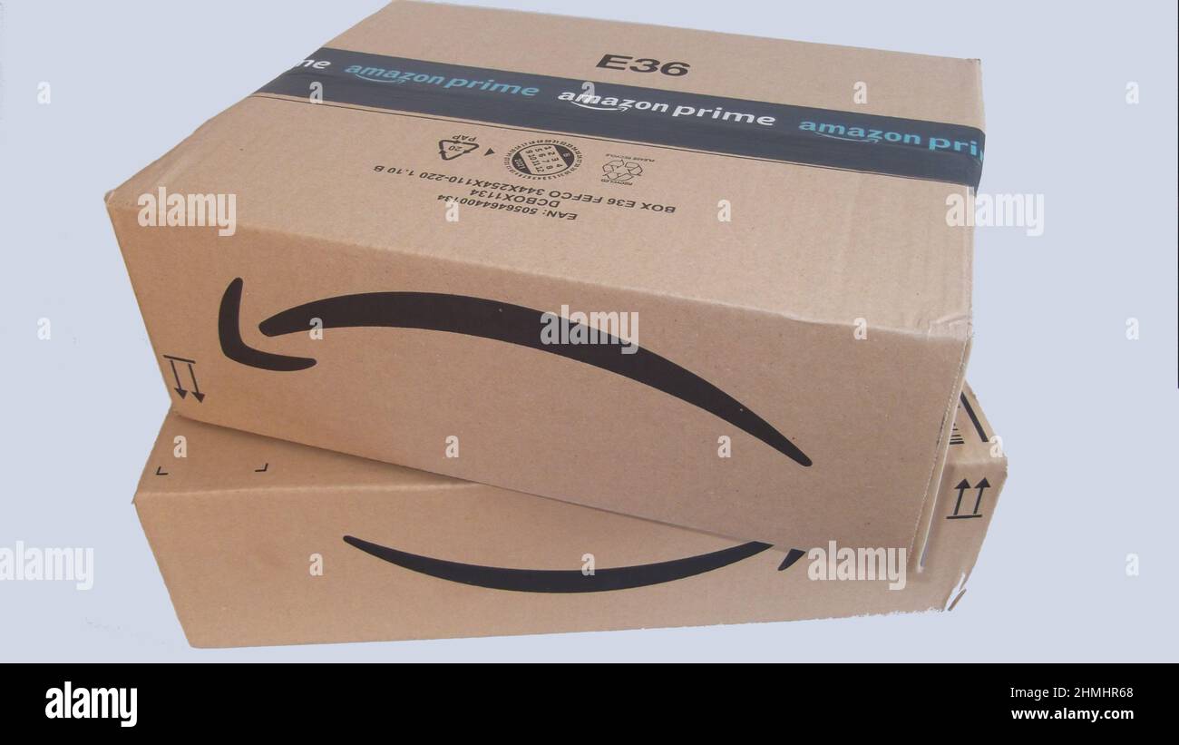 Amazon packages isolated on a pale blue background. Amazon doorstep ...