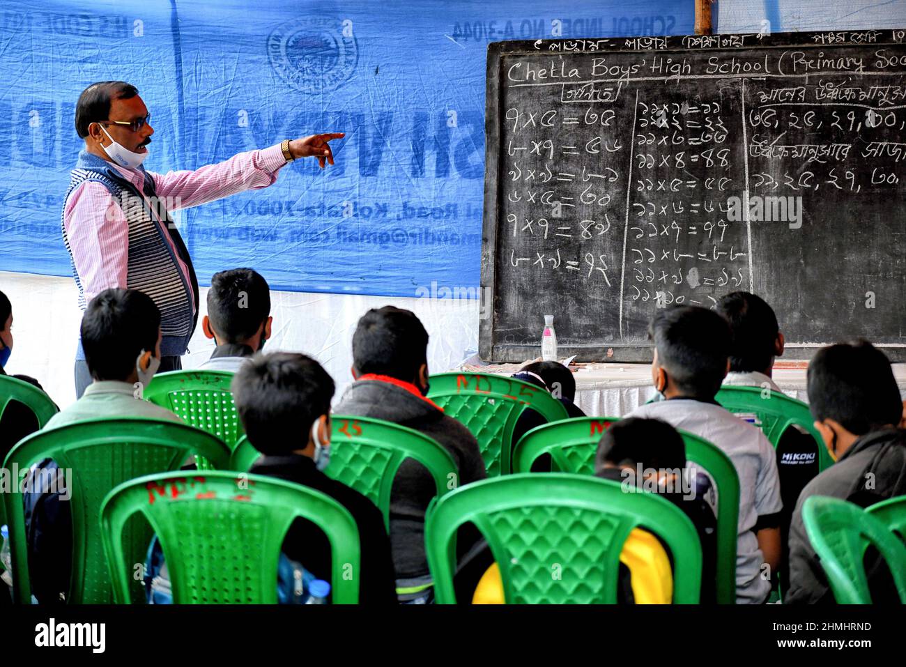 A teacher seen teaching students during an open air classes. The ...