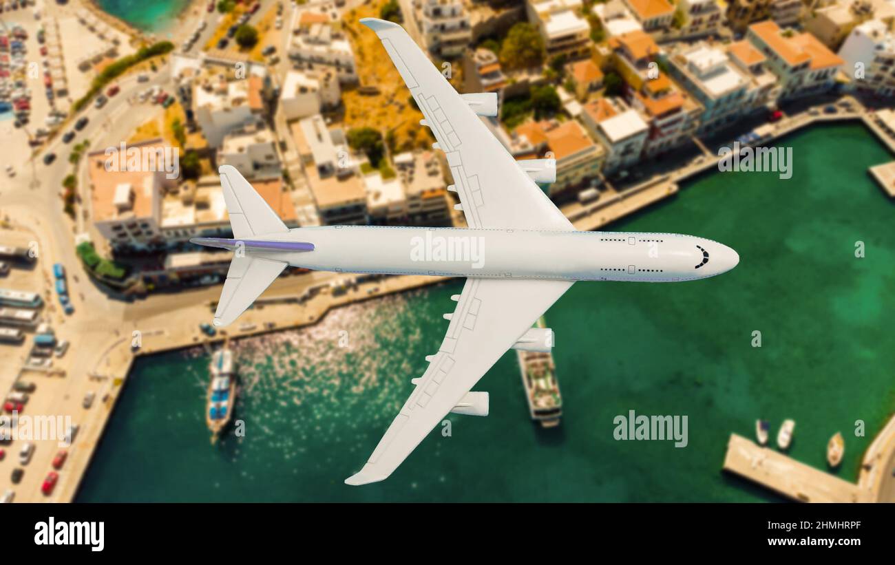 Aerial top down view of an airplane flying over blue sea as a travel ...