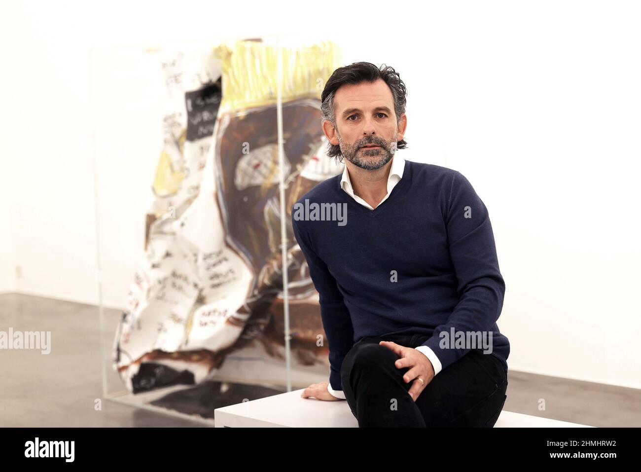 Duesseldorf, Germany. 10th Feb, 2022. Artist Niclas Castello sits in ...