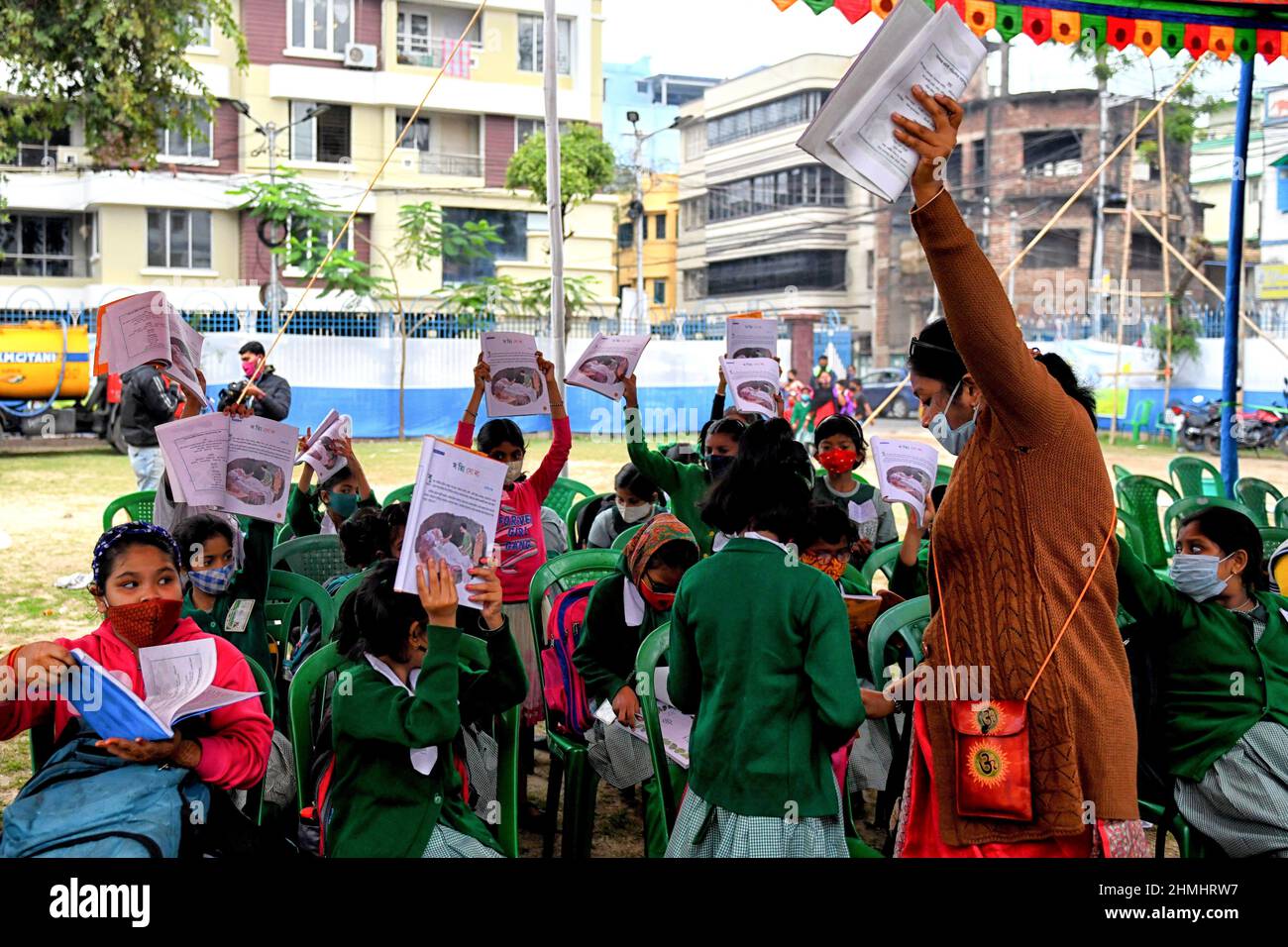 A teacher seen teaching students during an open air classes. The ...