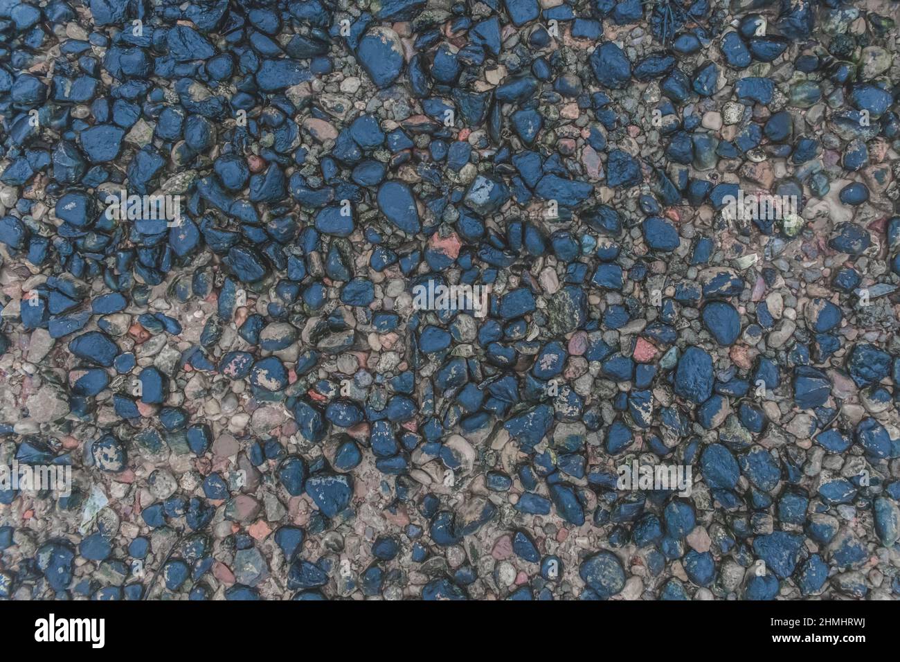 Pebbles dark blue river stone natural background shore surface rough ...