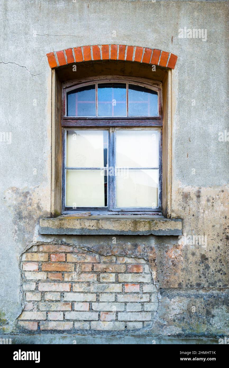 Textured window in an old house. Part of the wall with brickwork Stock ...