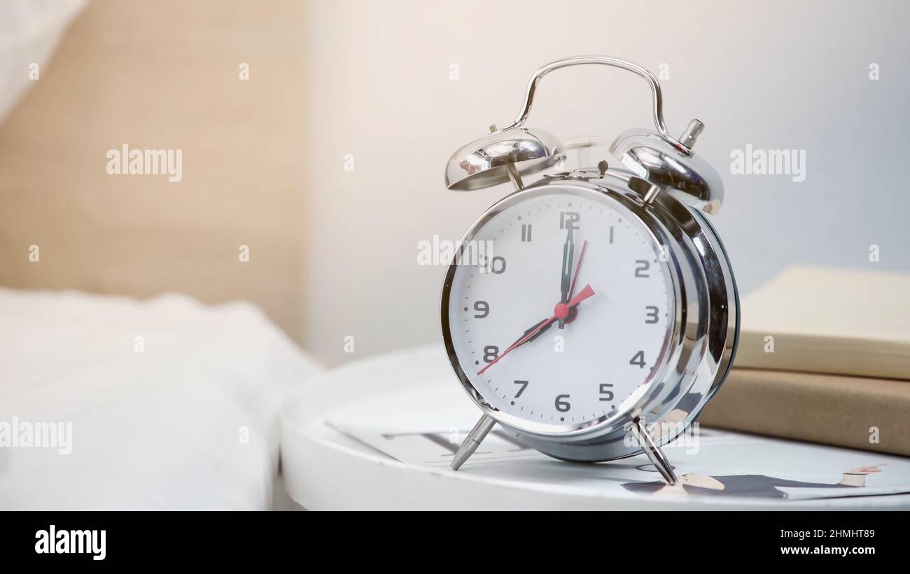 retro alarm clock showing eight am Stock Photo - Alamy