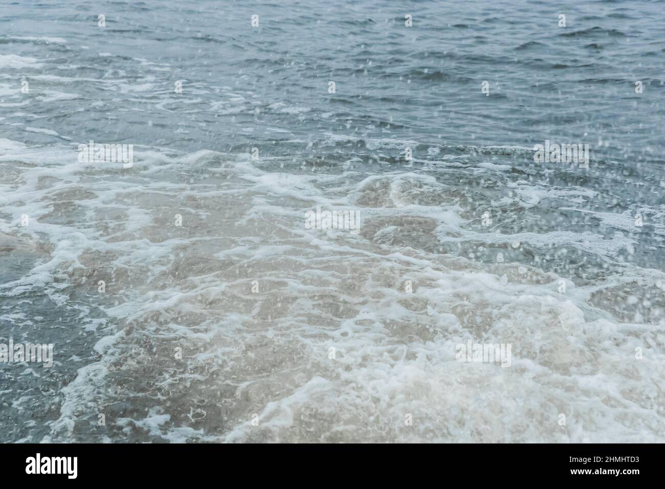 The surface of the lake water with a foam trace is a natural background ...