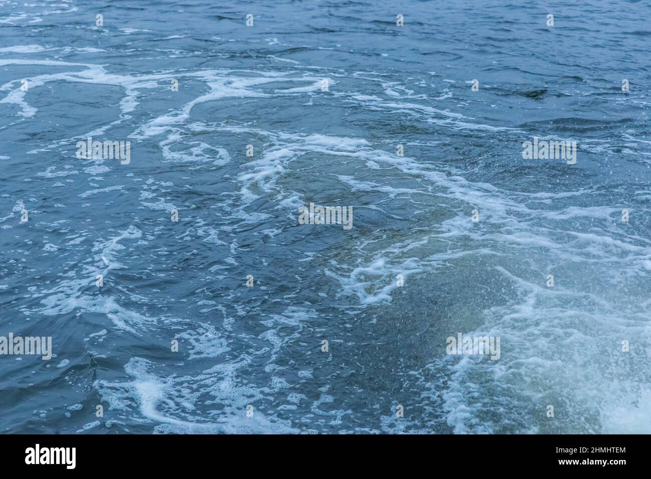 The surface of the lake water with a foam trace is a natural background ...