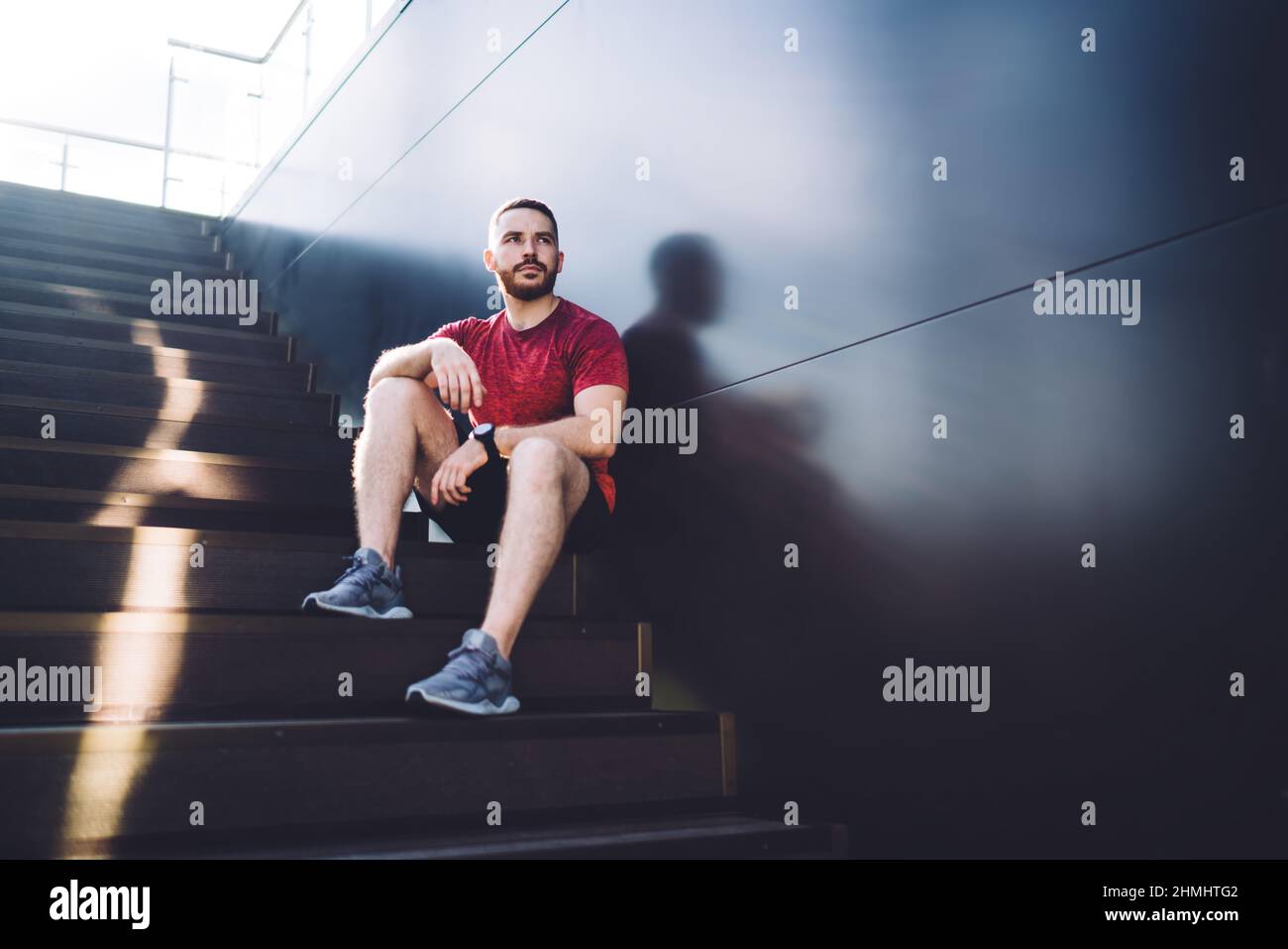 Man sitting on stairs hi-res stock photography and images - Alamy