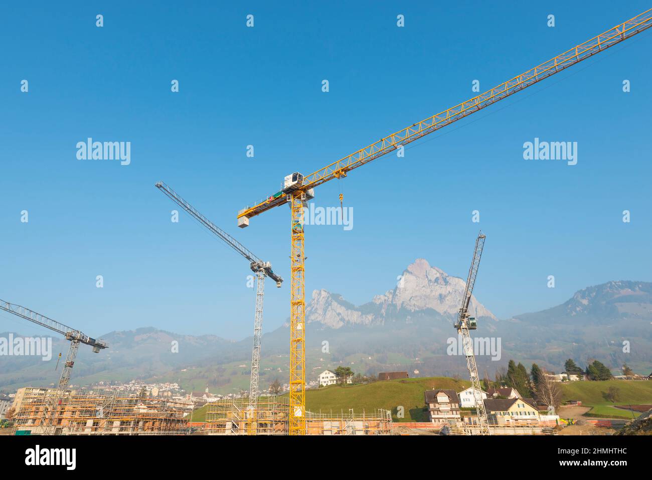 Cranes at the construction site. Color abstraction Stock Photo - Alamy