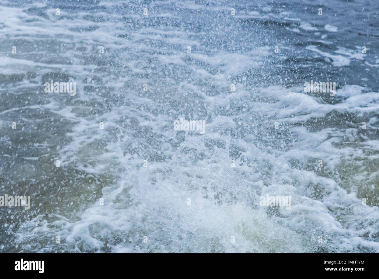 The surface of the lake water with a foam trace is a natural background ...