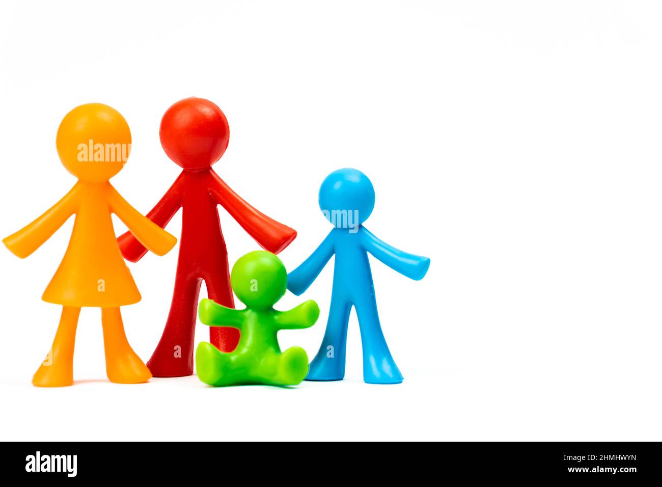 Figurines of the family stand on white isolated background. Concept of ...