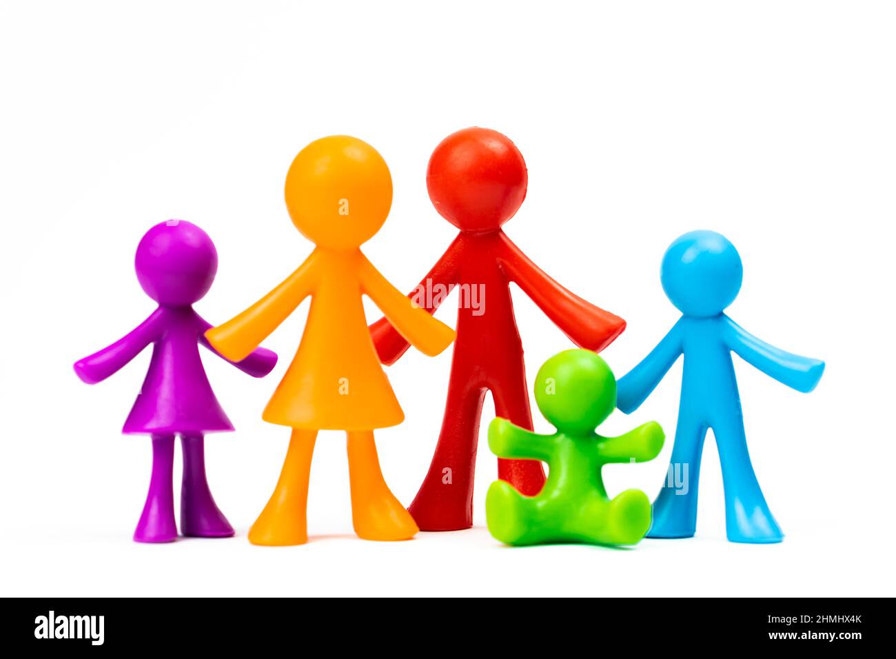 Figurines of the family stand on white isolated background. Concept of ...