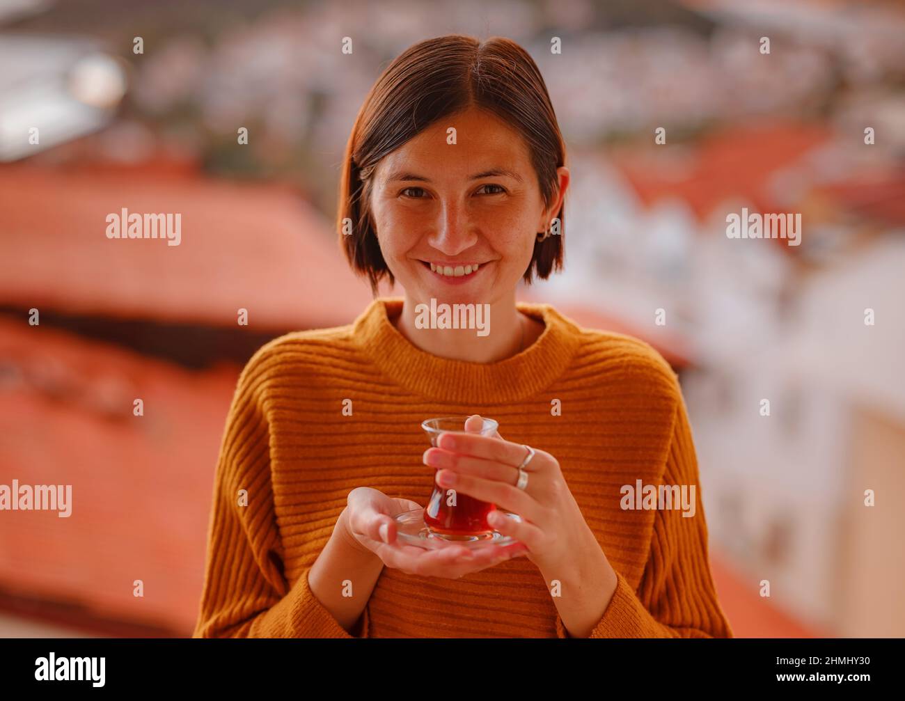 Woman drinking turkish tea from traditional turkish teacup and enjoys ...