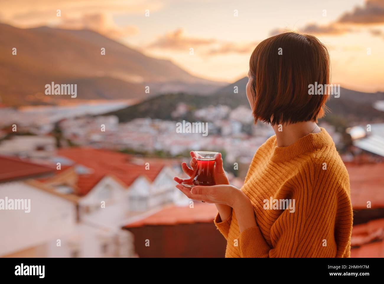 Woman drinking turkish tea from traditional turkish teacup and enjoys ...