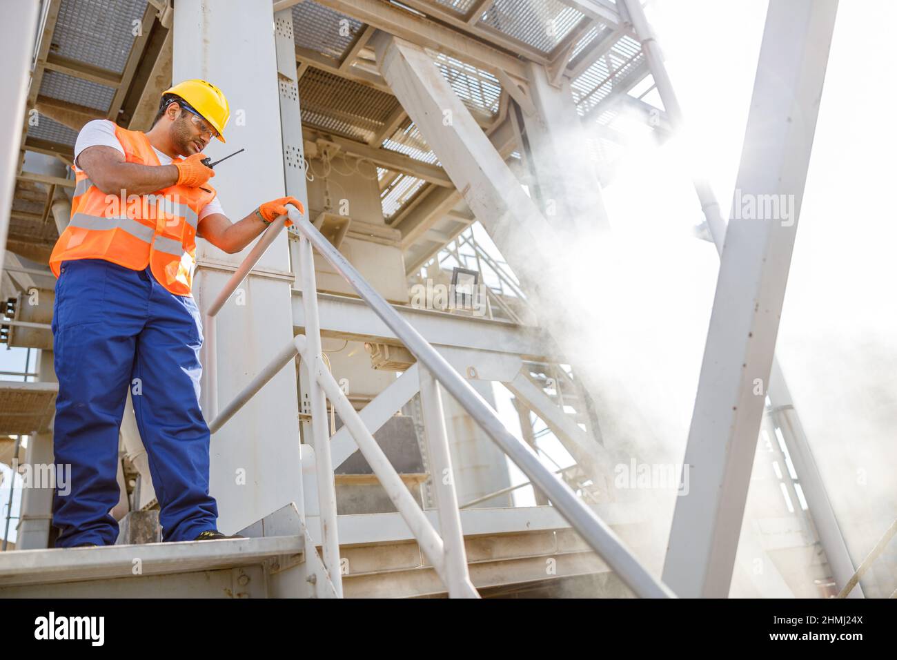 Experienced worker concentrating at his work in plant Stock Photo - Alamy