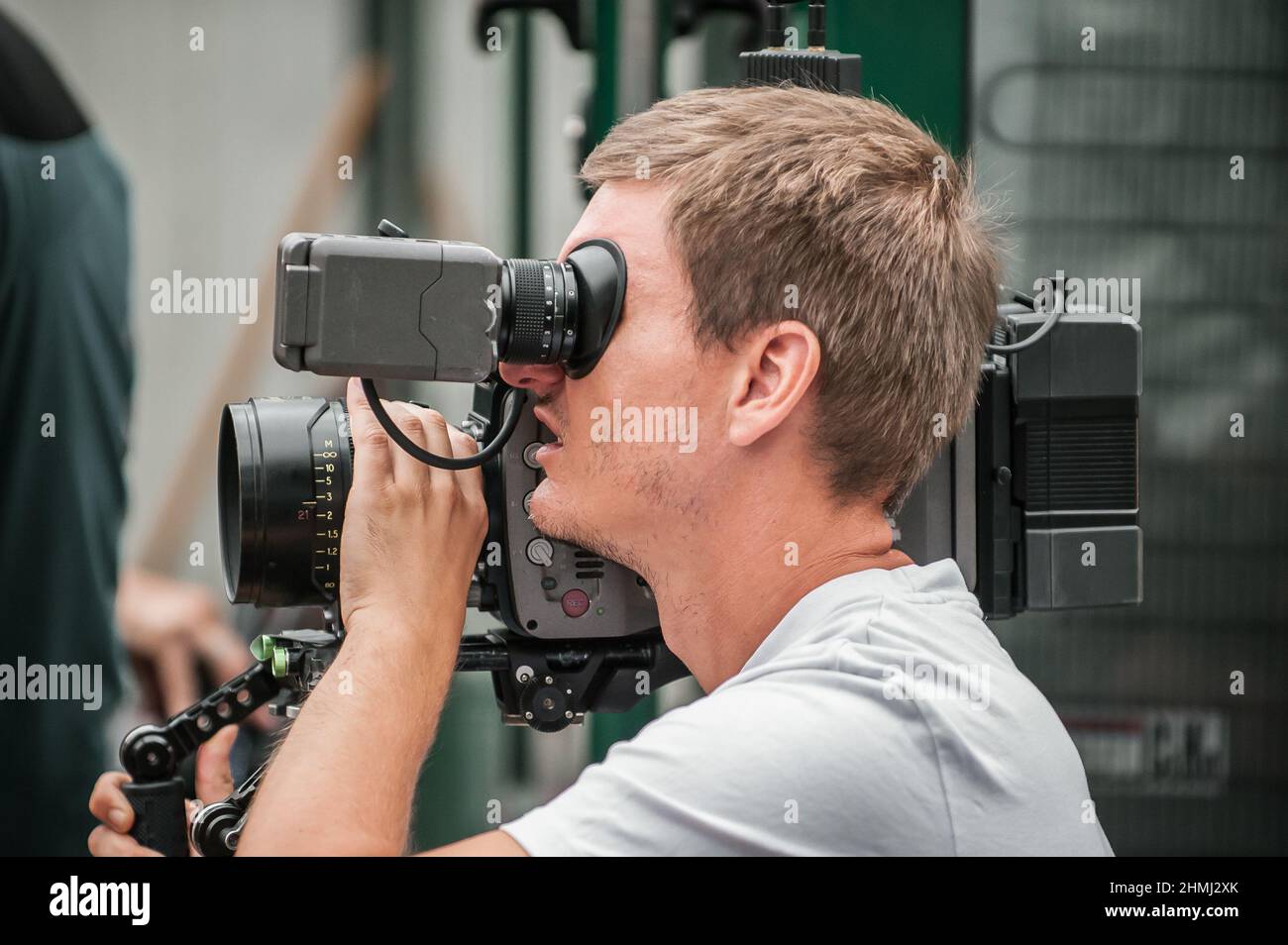 Behind the scene. Cameraman shooting the film scene with his camera on ...