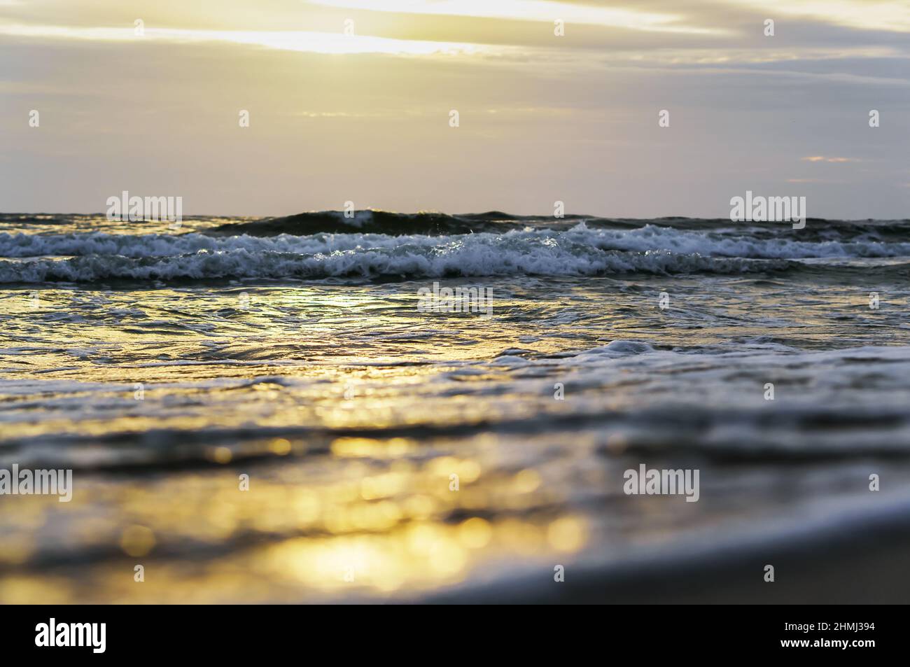Sunset over the sea. Reflection of sunlight in the sea waves. The sky ...