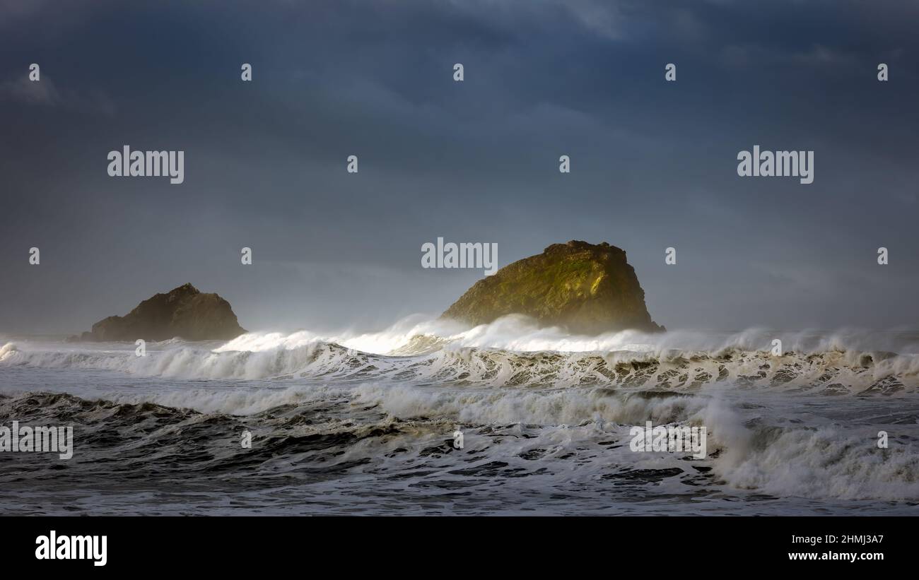 The sun breaks through the windy Pacific Ocean surf near False Klameth ...