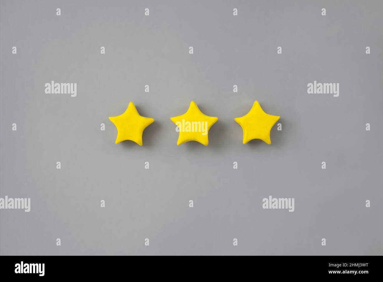 Three golden star on neutral background. Golden star shape. Concept of ...