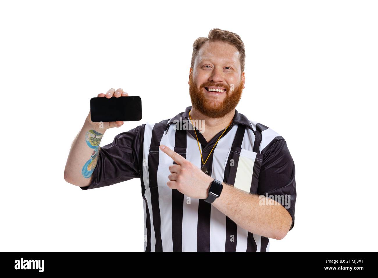 Portrait of young bearded man, soccer or football referee using phone ...