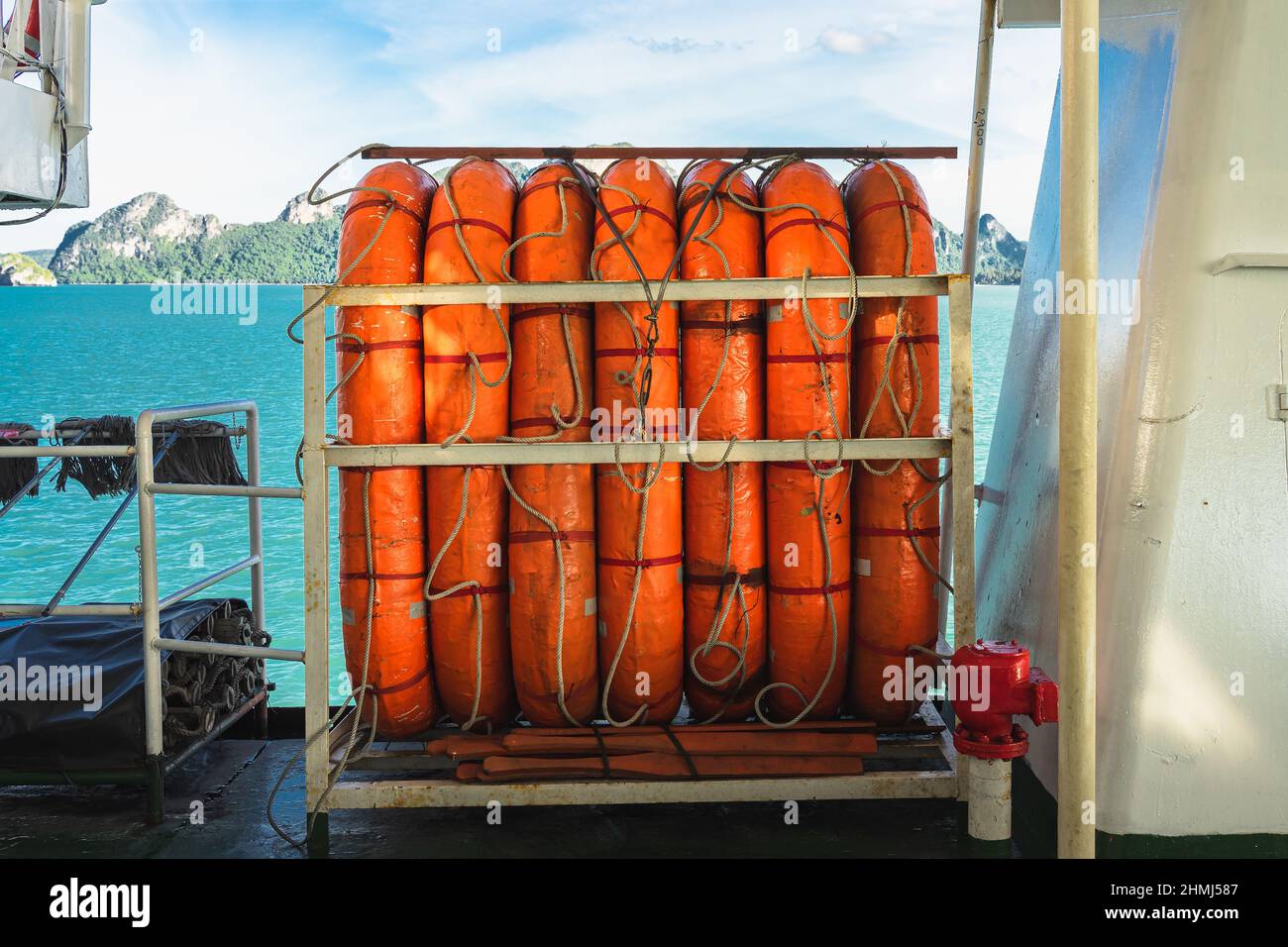 Orange inflatable lifeboats on ferry deck for emergencies and maritime ...