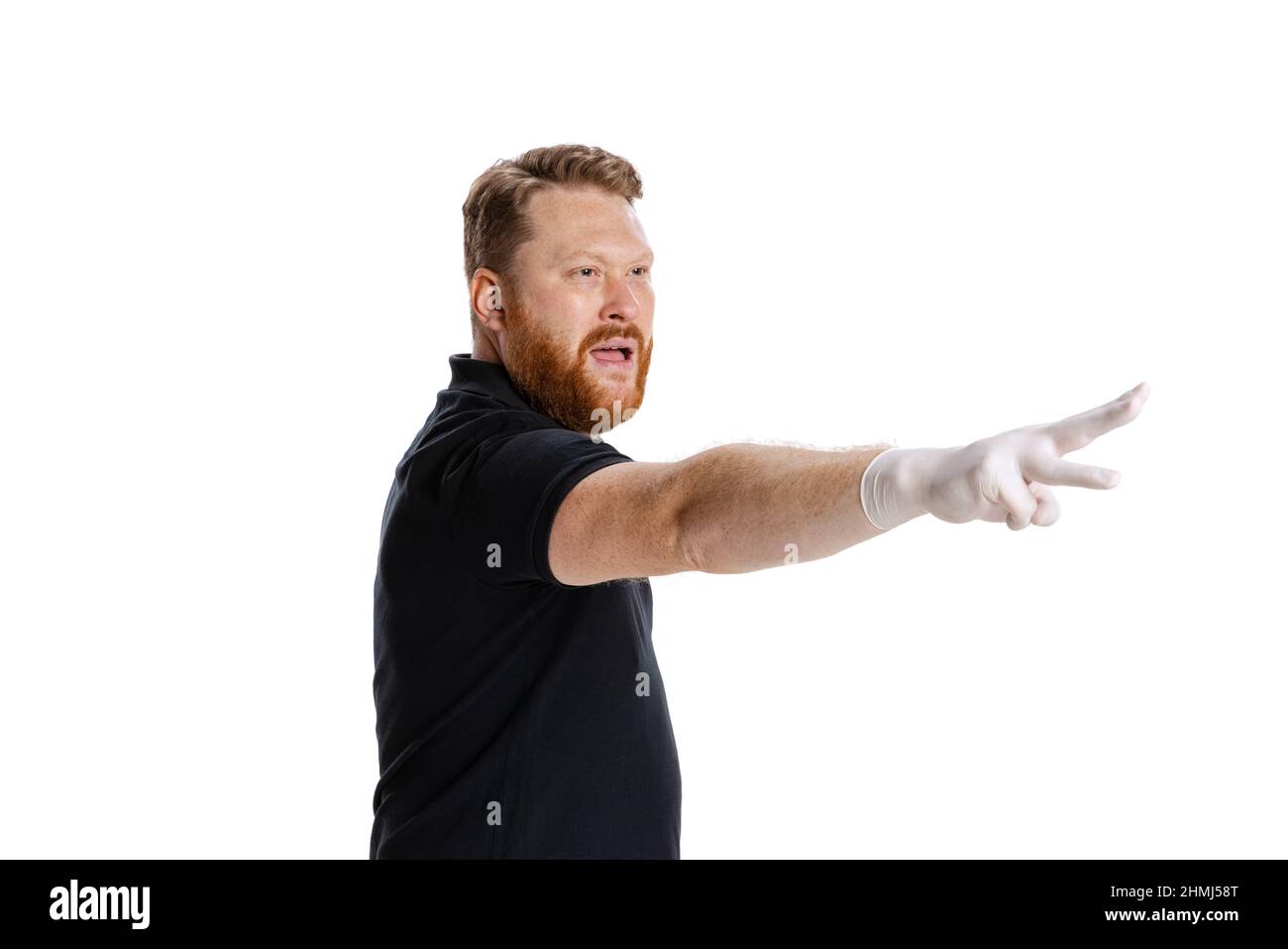 Studio shot of sport referee wearing black t-shirt referees the game ...