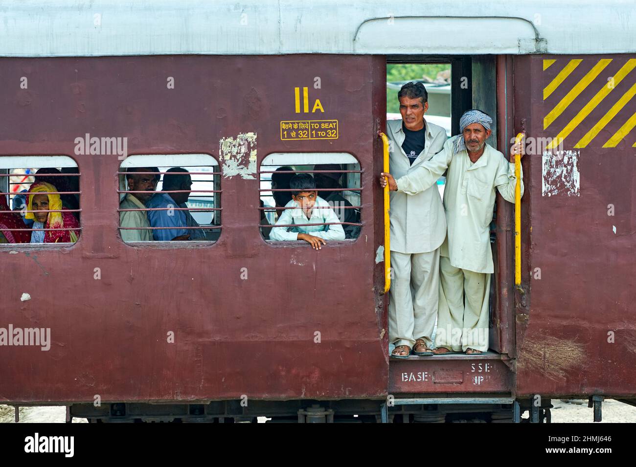 India Rajasthan. Passengers on a third class train Stock Photo - Alamy
