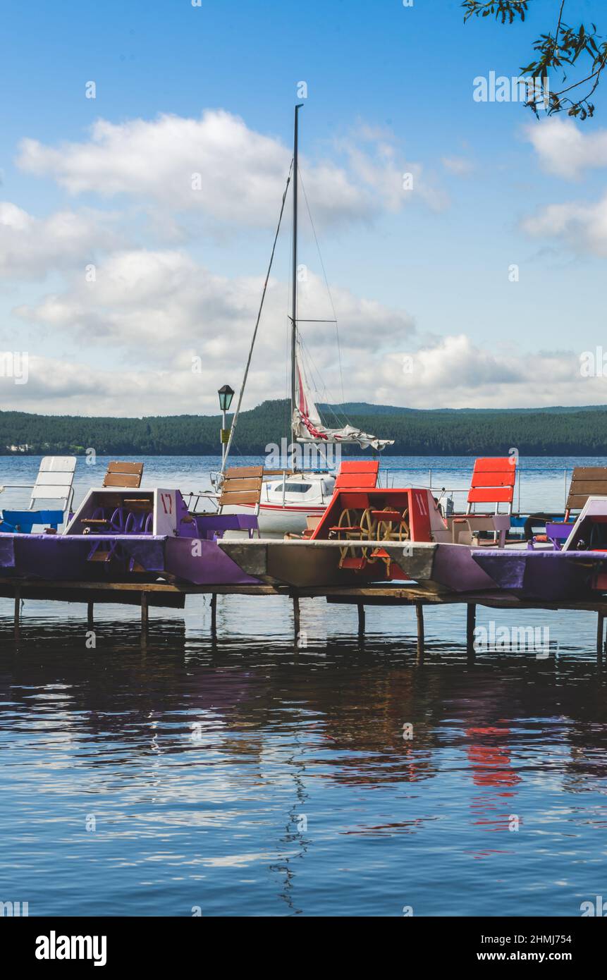 Yachts and catamarans on the pier by the lake.Good weather calm Stock ...