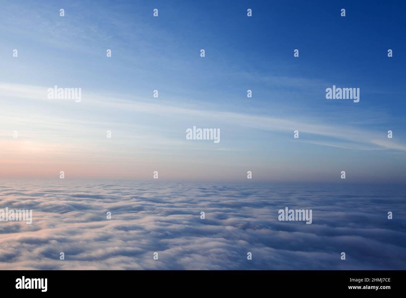 Above the clouds, sunrise or sunset. Clear sky over the fog. View from ...