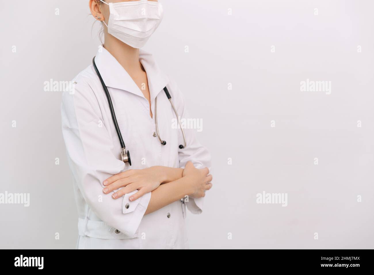 Doctor with stethoscope in medical coat on white background. Front ...