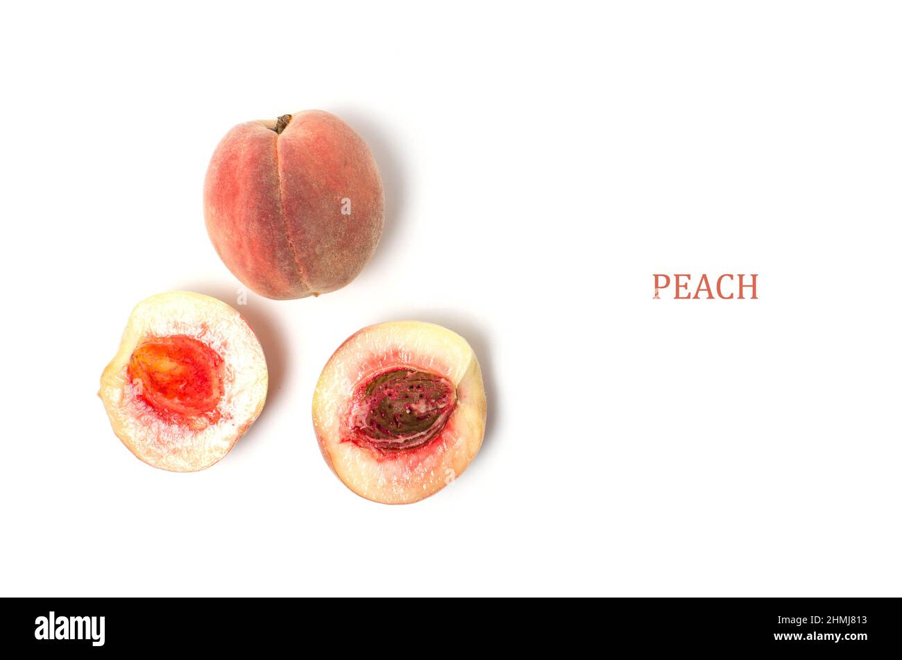 Whole and two halves of a peach on white background.Fruit view from the ...